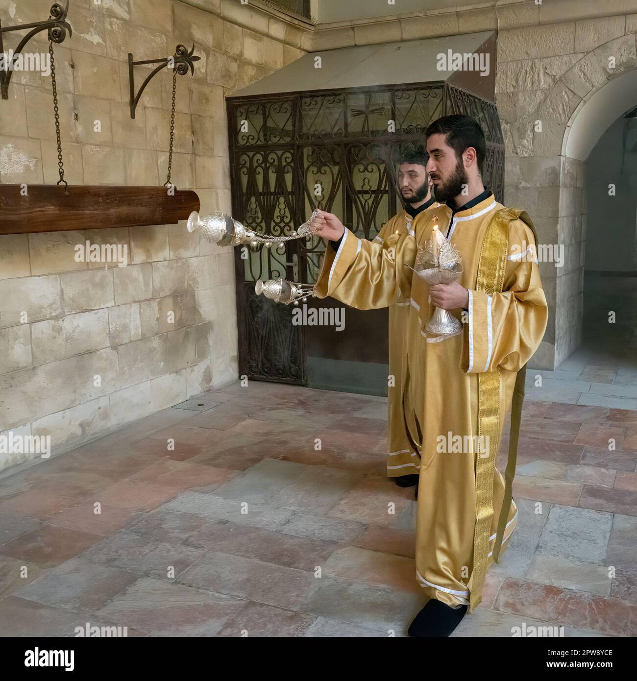 Jerusalem, Israel - November 12th, 2022: Armenian priests swinging ...