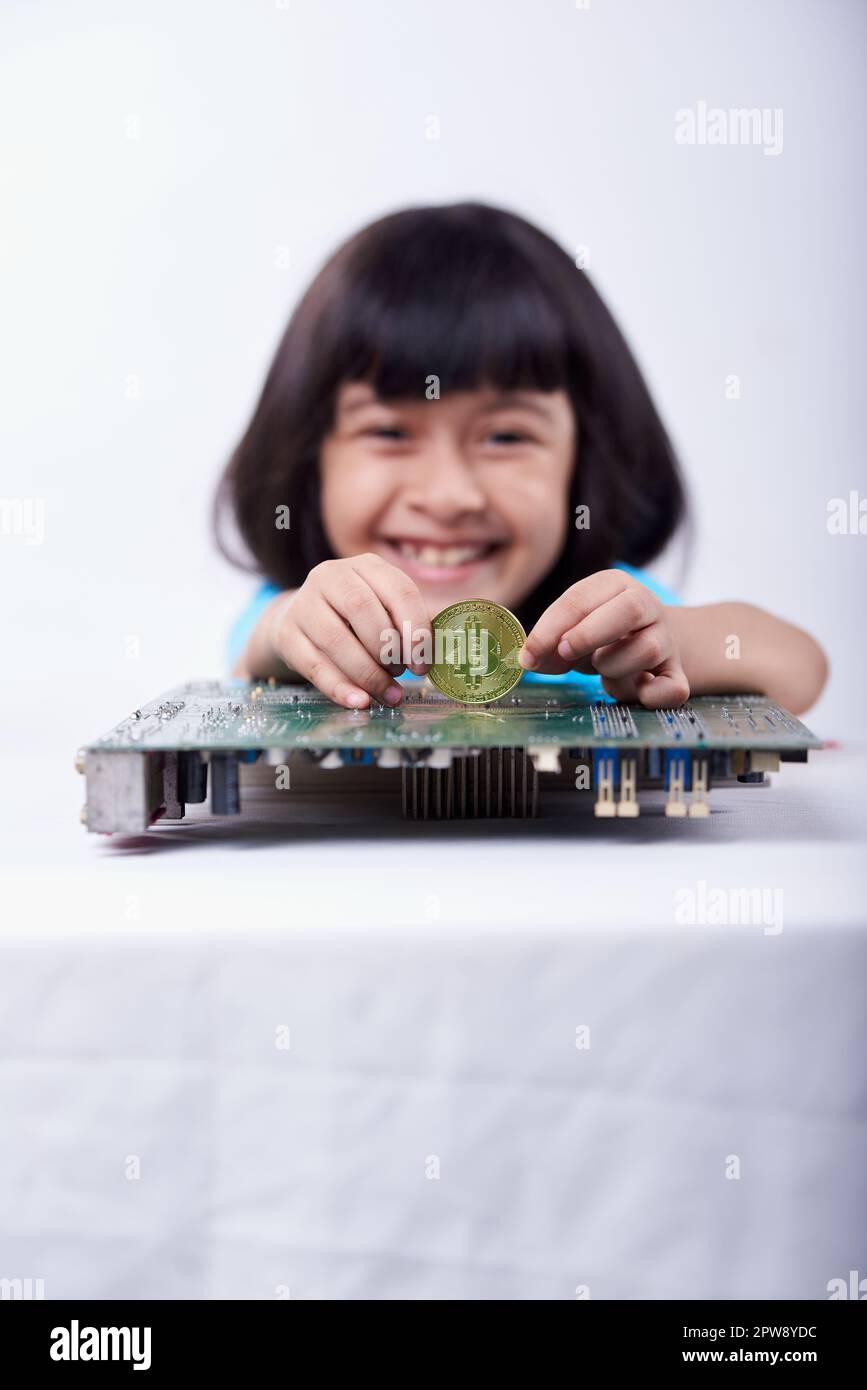 cute child girl showing cryptocurrency coin on hand Stock Photo - Alamy