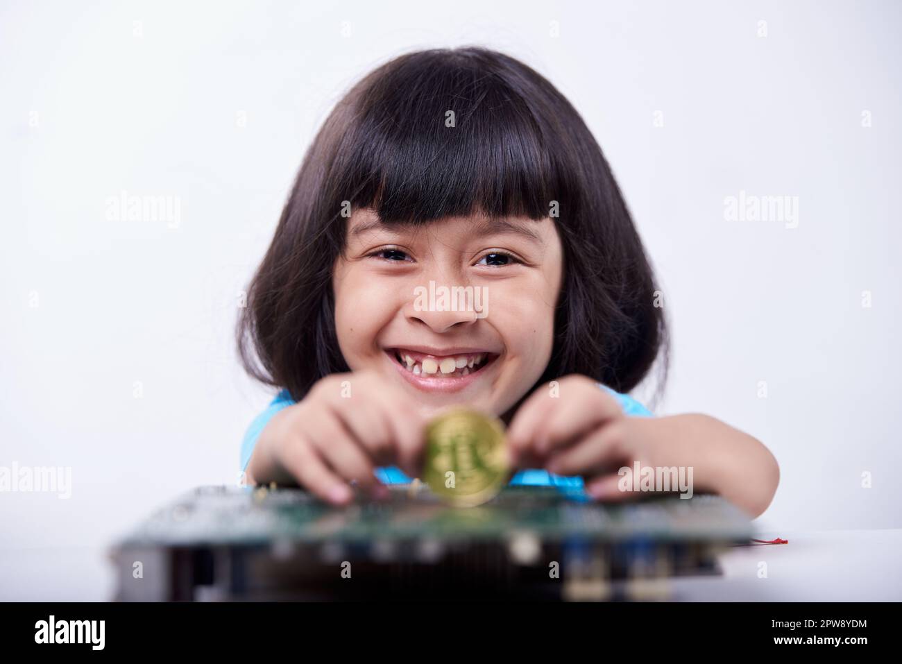 cute child girl showing cryptocurrency coin on hand Stock Photo - Alamy
