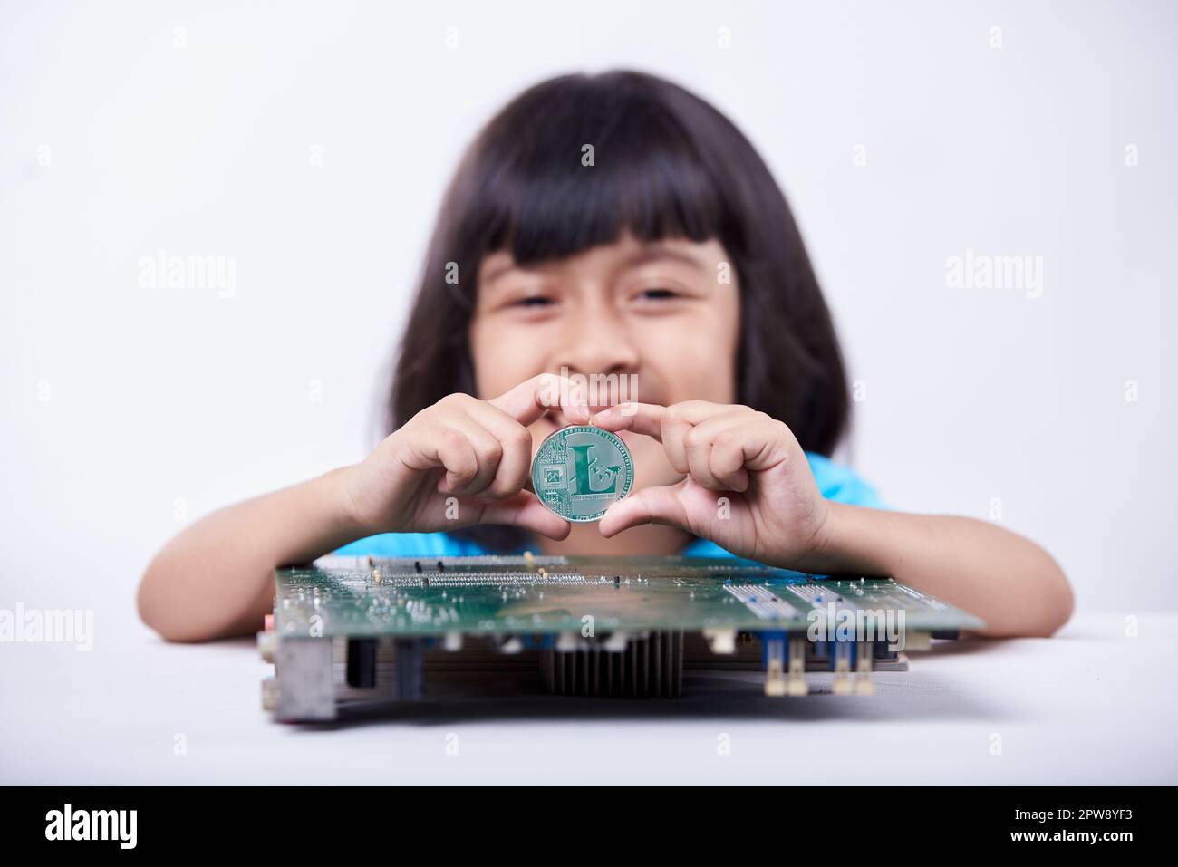 cute child girl showing cryptocurrency coin on hand Stock Photo - Alamy