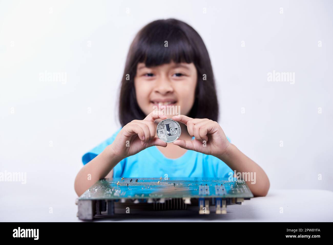 cute child girl showing cryptocurrency coin on hand Stock Photo - Alamy