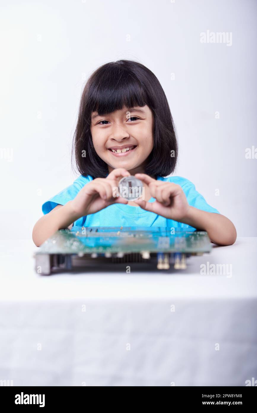 cute child girl showing cryptocurrency coin on hand Stock Photo - Alamy