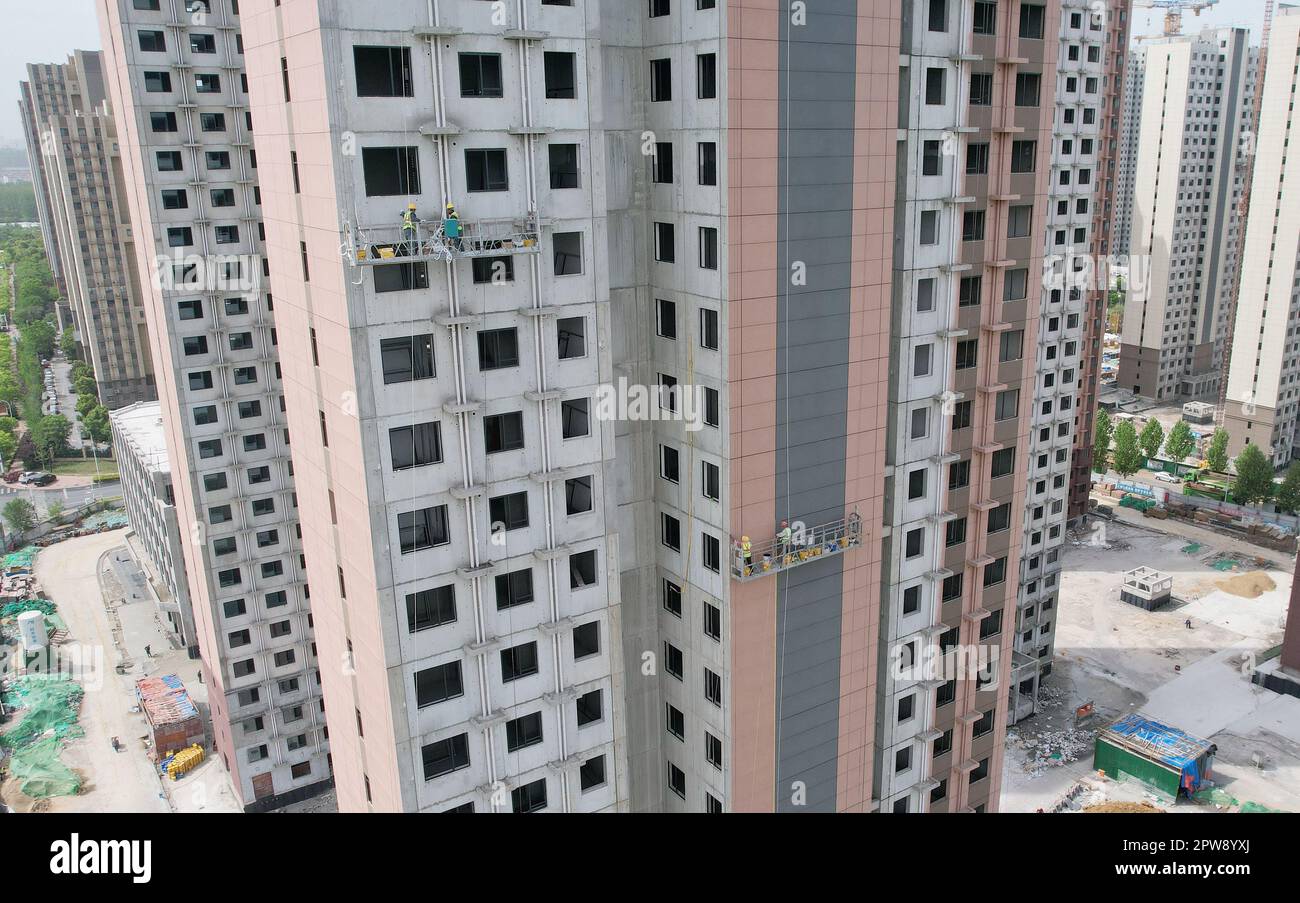HEFEI, CHINA - APRIL 29, 2023 - Workers decorate the outside of a ...