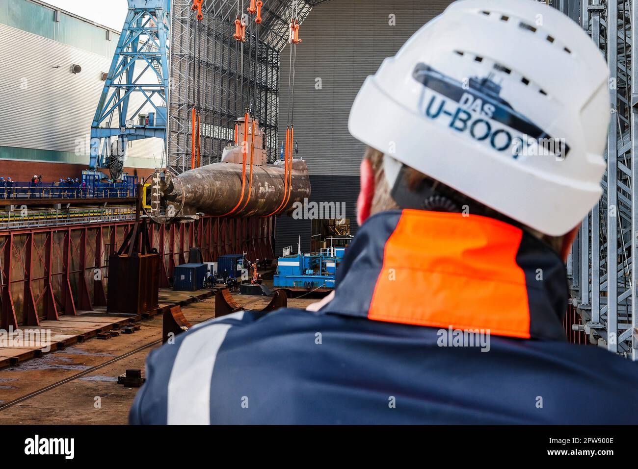 Kiel, Germany. 28th Apr, 2023. The submarine U17 is loaded onto a ...