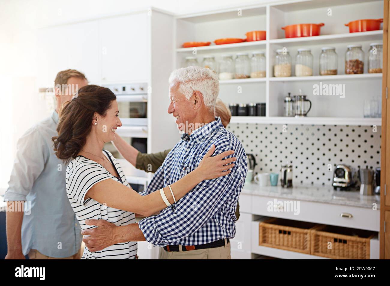 Thank you for coming to visit. a loving family greeting each other with ...