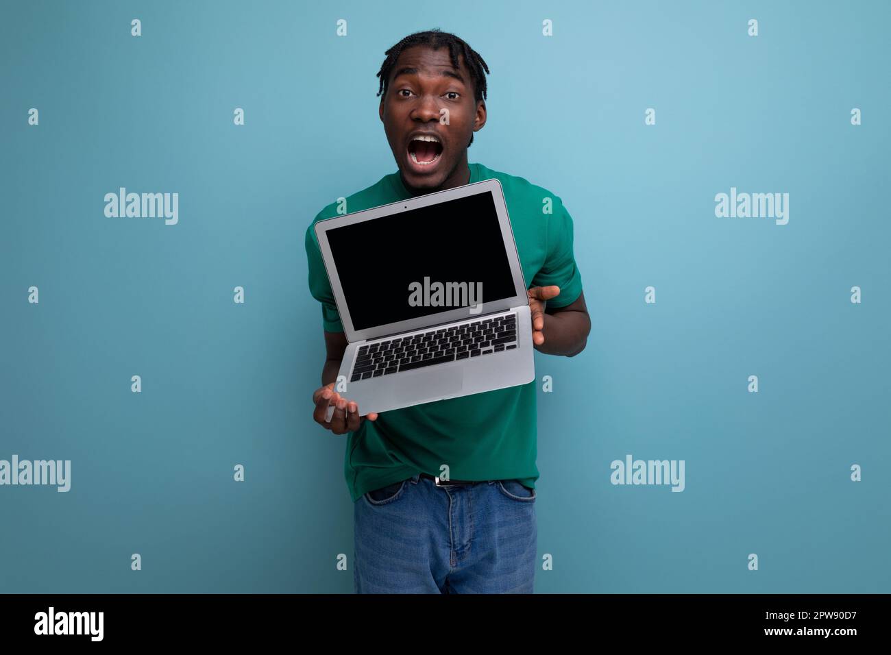 charismatic consultant demonstrates laptop screen on studio background ...