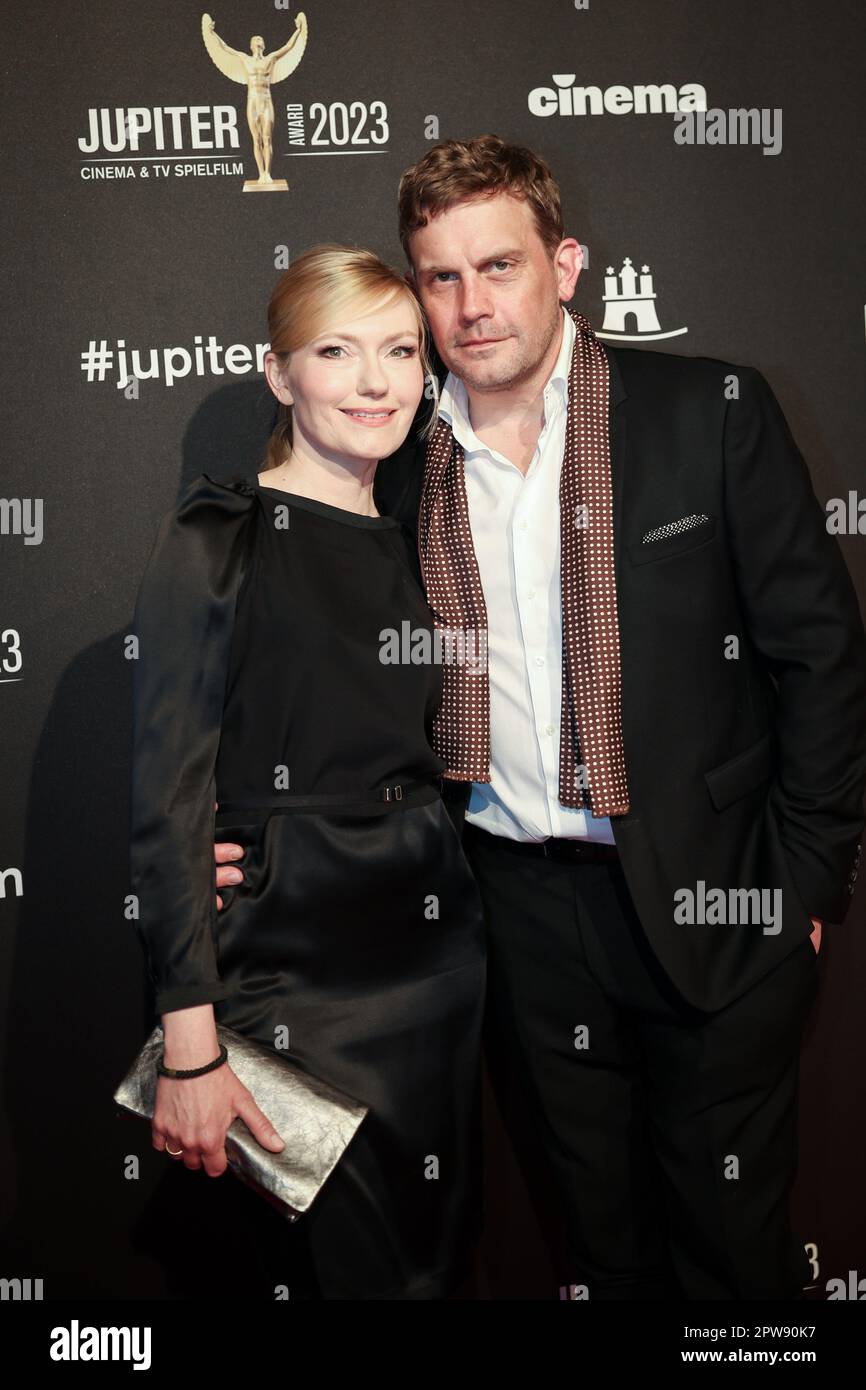 27 April 2023, Hamburg: Sebastian Bezzel (r), actor, and his wife ...