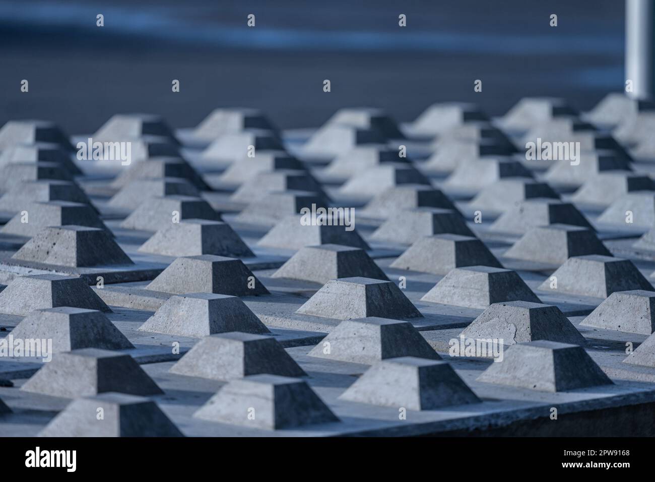 Abtract pattern of pegs on top of concrete blocks Stock Photo - Alamy