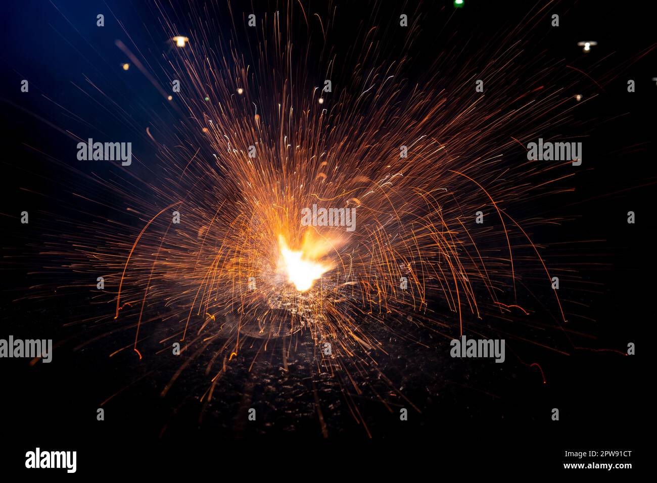 Yellow ground fireworks on asphalt Stock Photo - Alamy