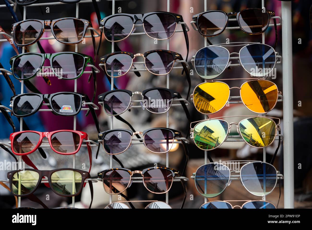 Range of different coloured and shapes of sunglasses on display near ...