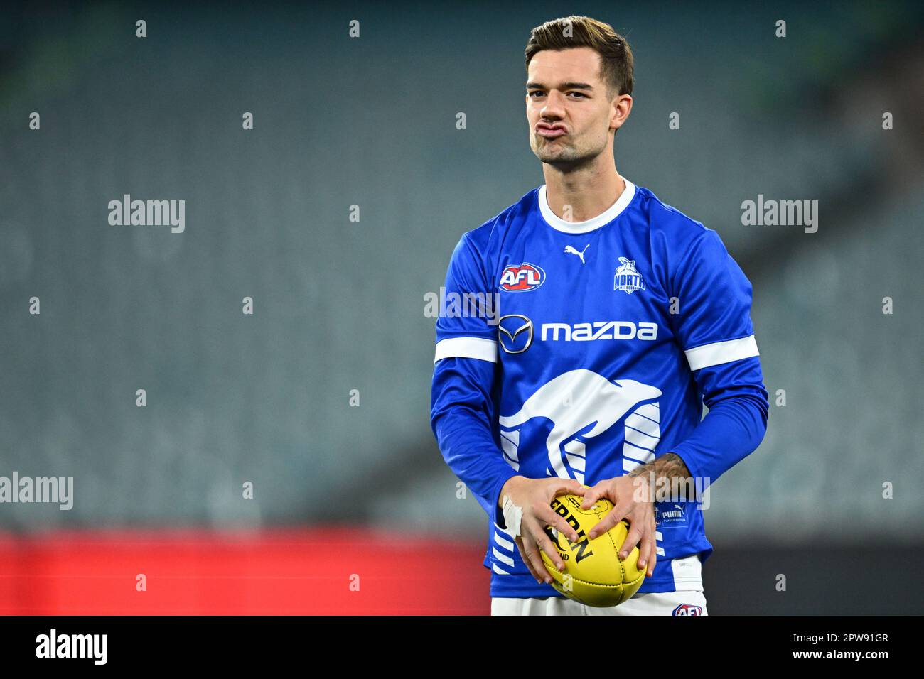 Jy Simpkin of North Melbourne warms up during the AFL Round 7 match ...