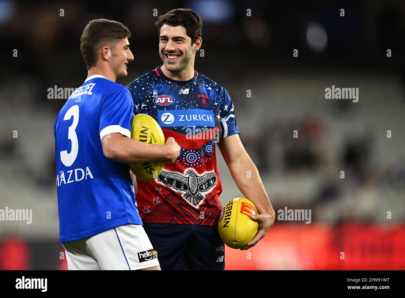 Harry Sheezel of North Melbourne and Christian Petracca of Melbourne ...