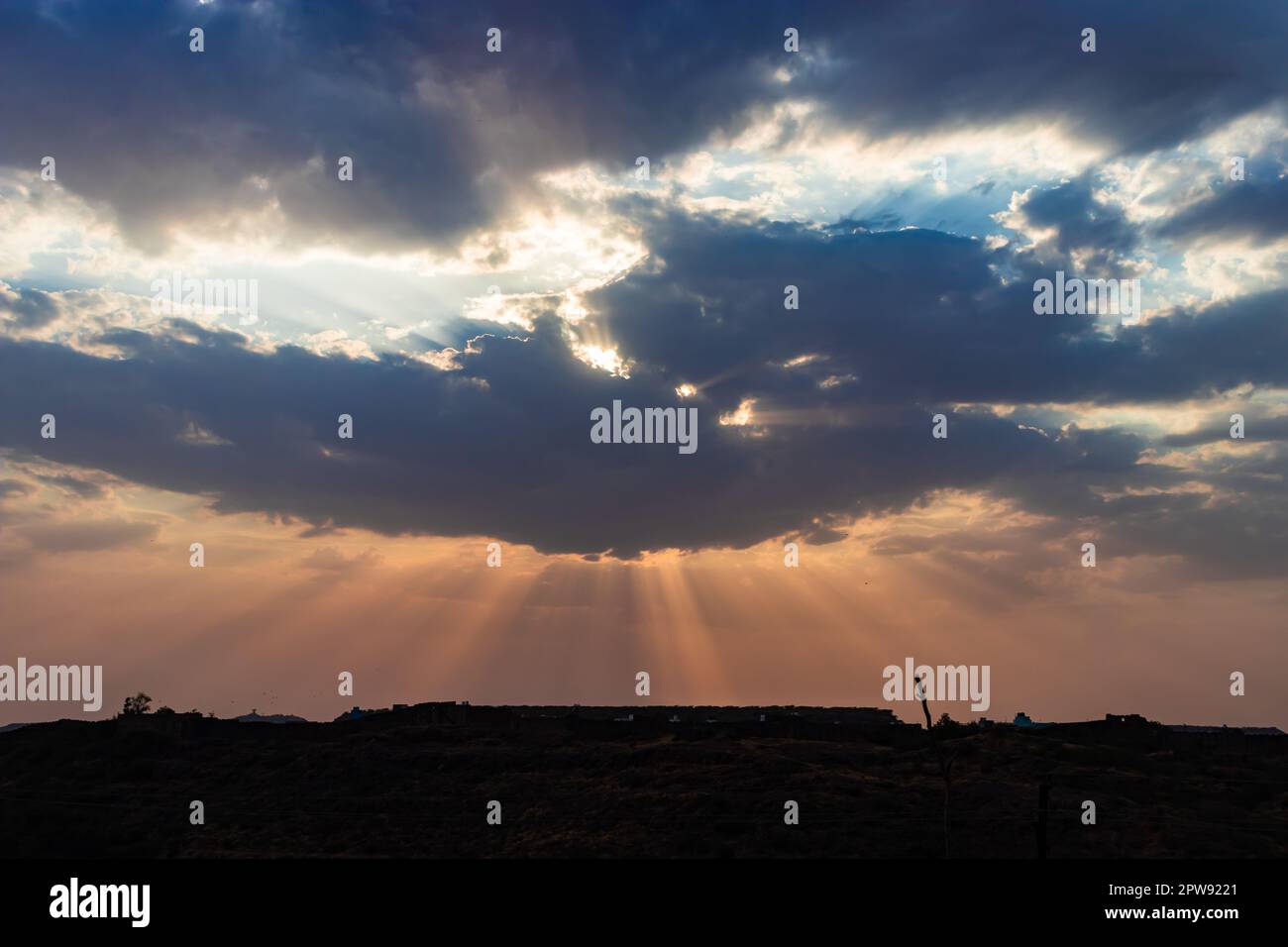 sunrise dramatic sky with sun beams with dark clouds at dawn Stock ...
