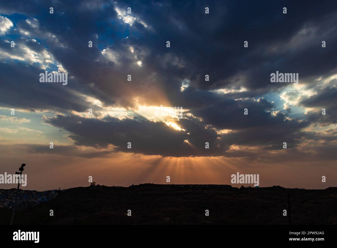 sunrise dramatic sky with sun beams with dark clouds at dawn Stock ...