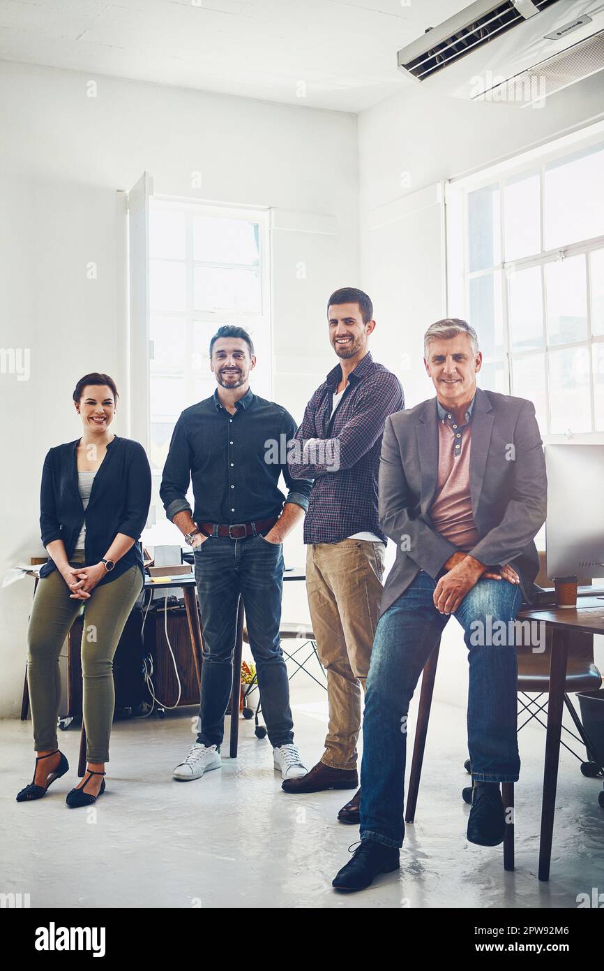 We get it right before taking the next step. Portrait of a team of creative workers standing ...