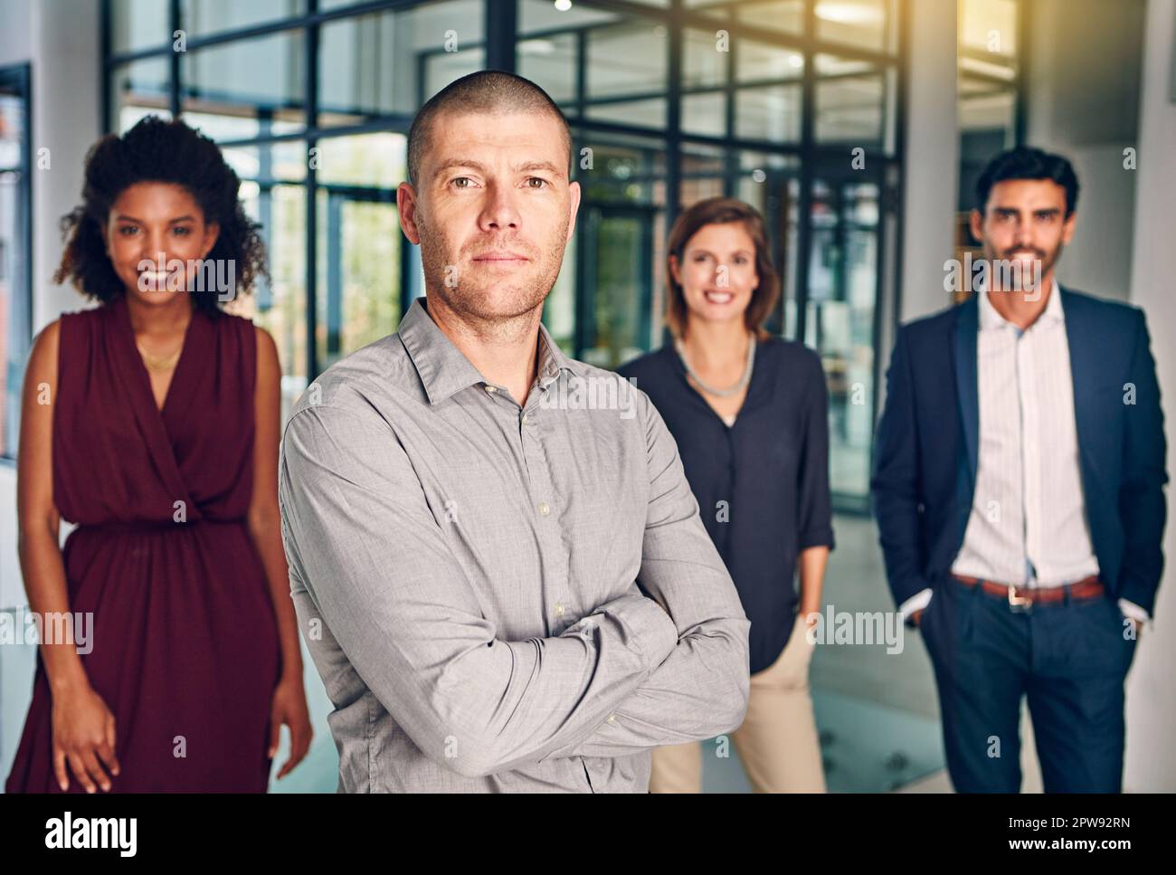 Managing a strong team takes strong leadership. Portrait of a team of ...