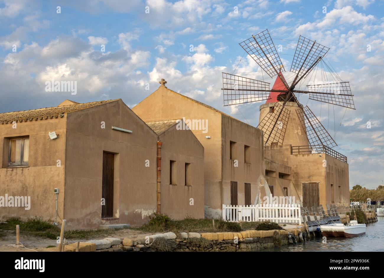 Salt pans and windmills for processing the sea salt. Channel among them ...
