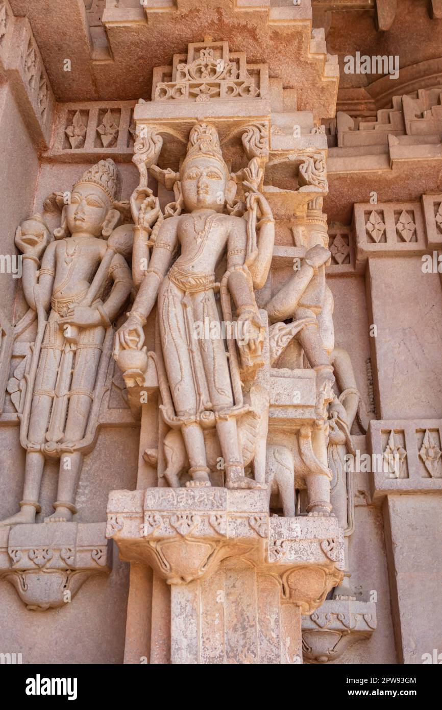 hindu god unique idol engraved art on temple wall from flat angle at ...