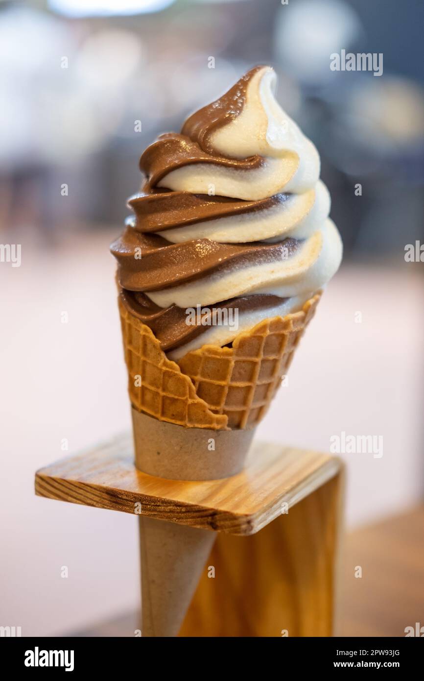 Vanilla and Chocolate Ice cream with waffle cone. blur background Stock ...
