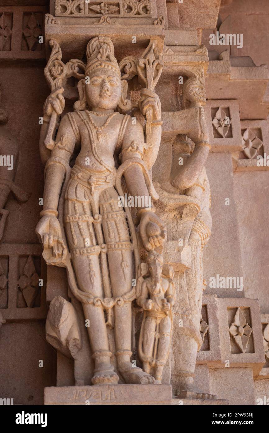 hindu god unique idol engraved art on temple wall from flat angle at ...