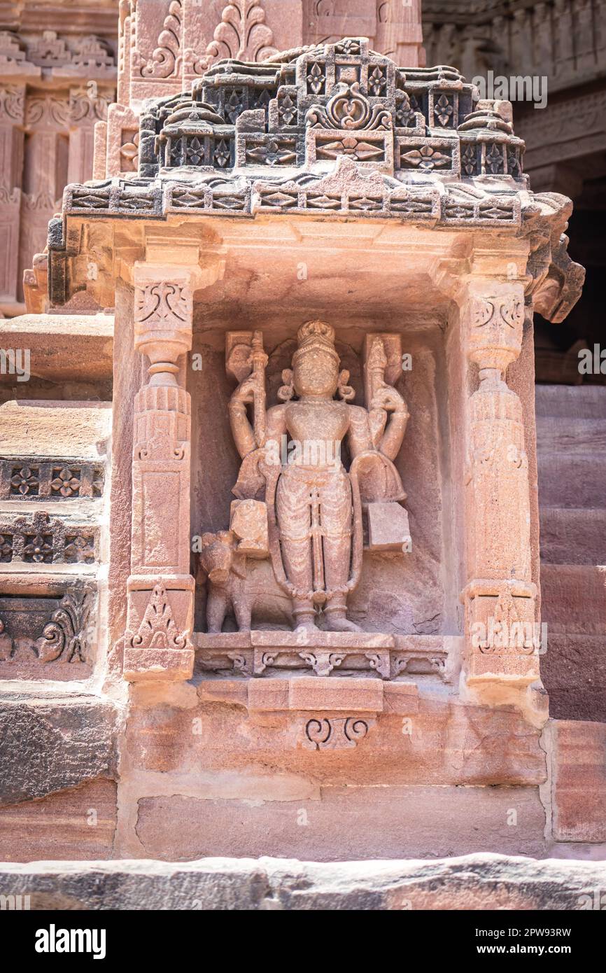 hindu god unique idol engraved art on temple wall from flat angle at ...