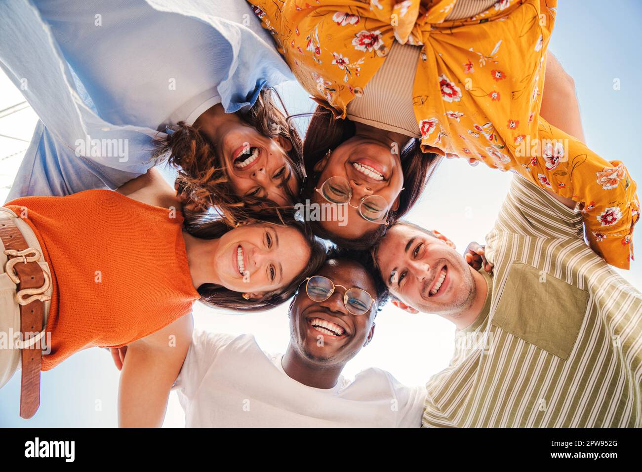 Group of people embracing in a circle hi-res stock photography and ...