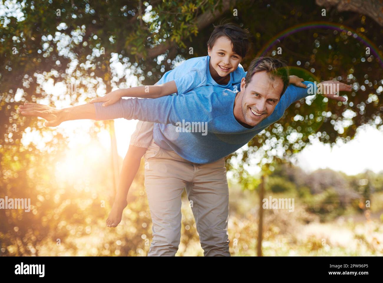 Flying dad airlines. Portrait of a father and his young son spending ...