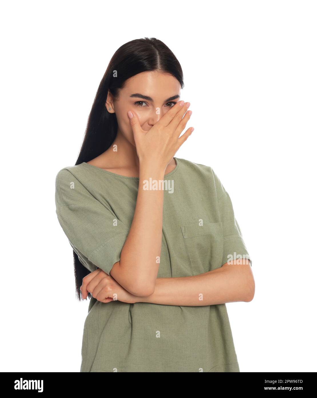 Embarrassed woman covering face with hand on white background Stock ...