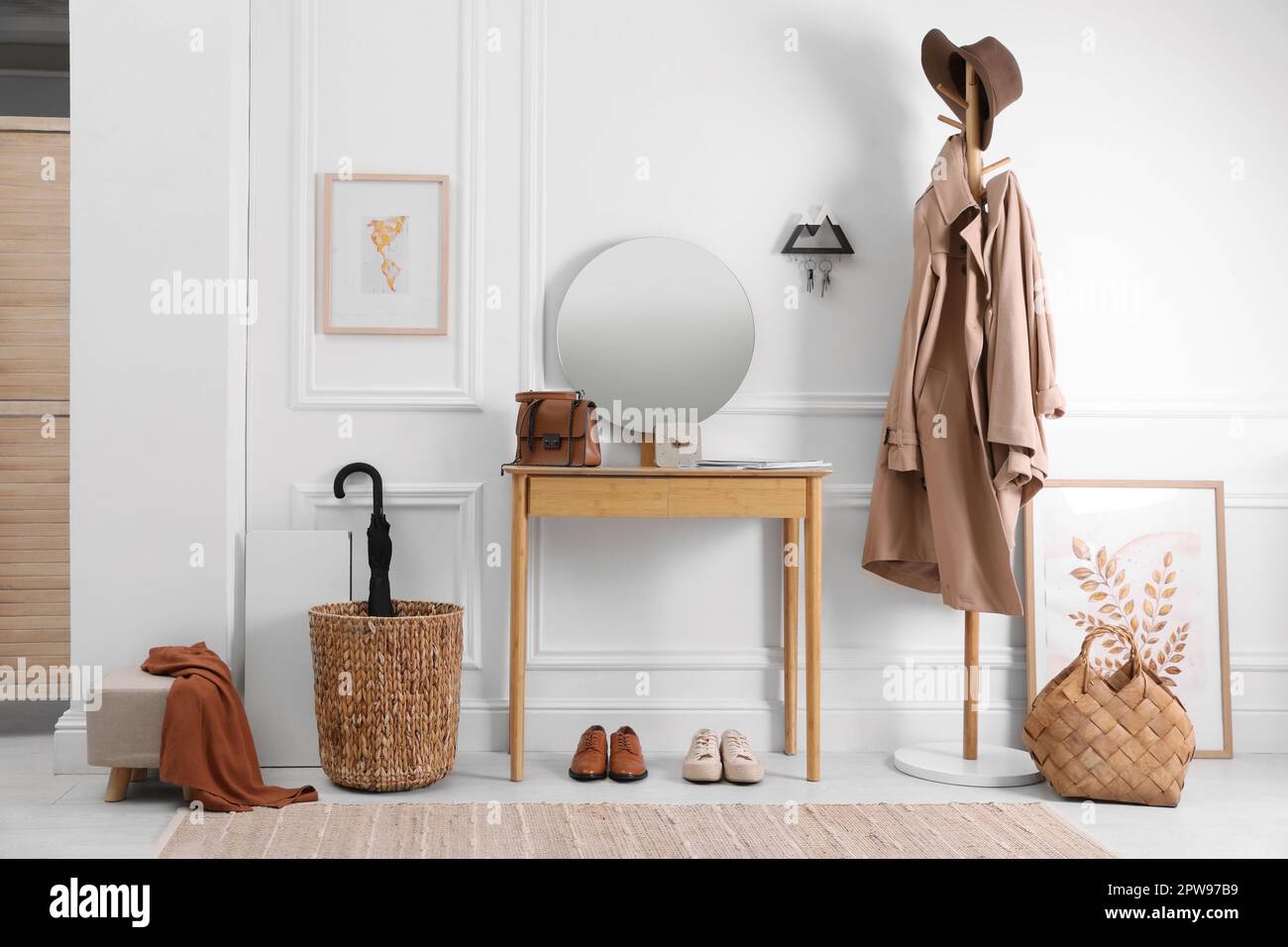 Modern hallway interior with stylish dressing table and key holder ...