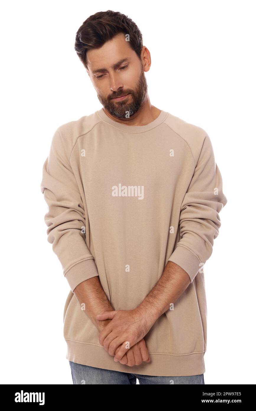 Embarrassed man in pullover on white background Stock Photo - Alamy
