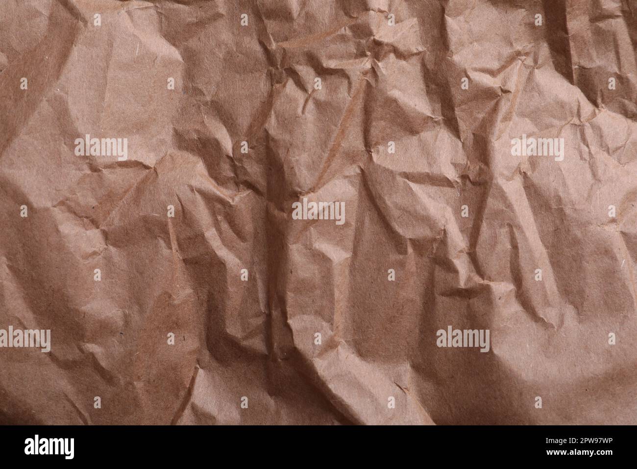 Texture of wrinkled kraft paper bag as background, closeup Stock Photo ...