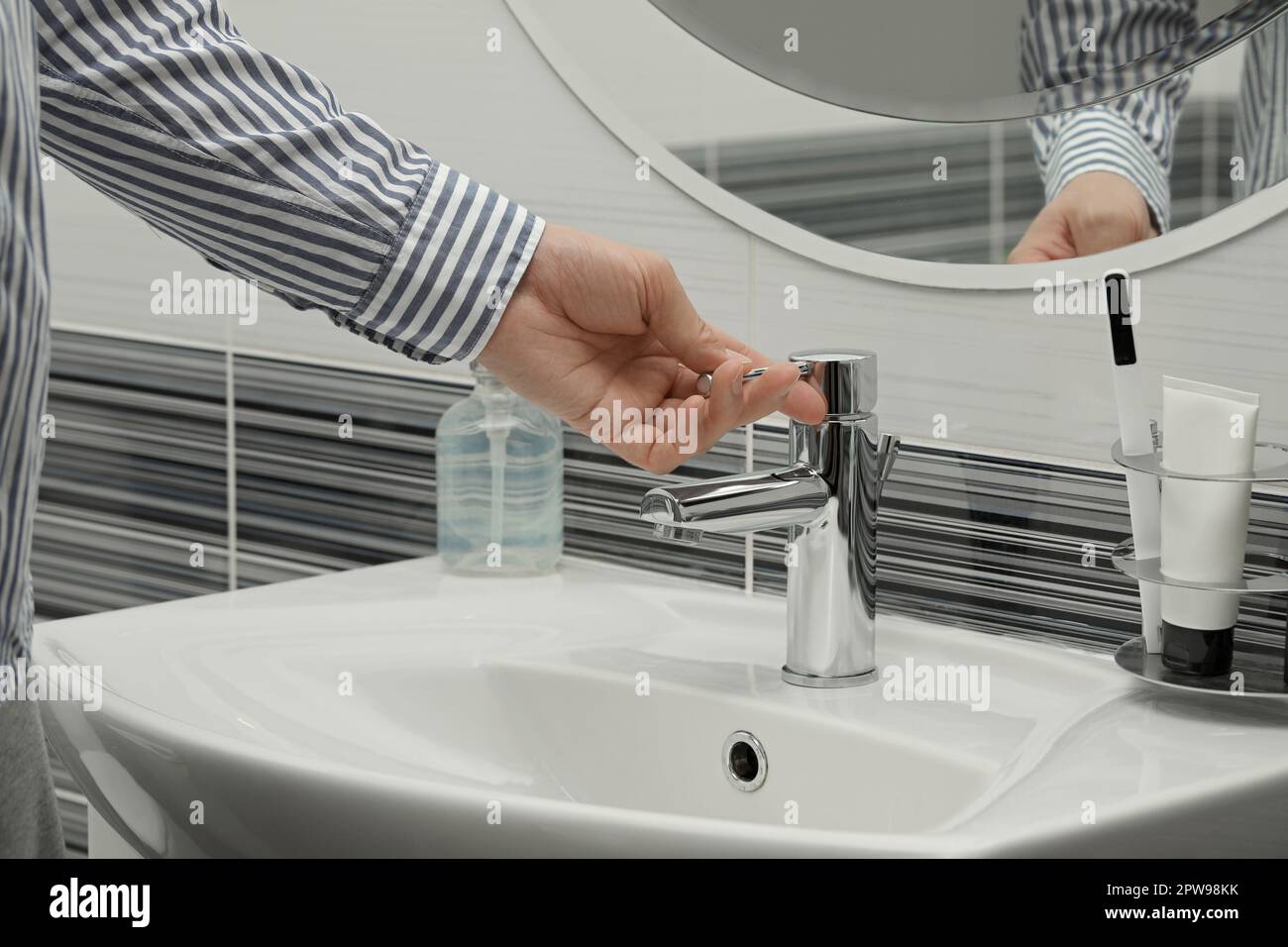 Sink tap white chrome shiny metallic hand bathroom hi-res stock ...