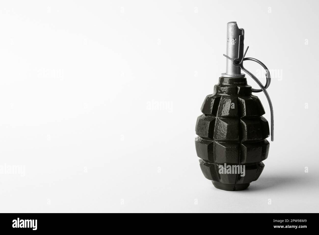 Hand grenade on white background. Space for text Stock Photo - Alamy
