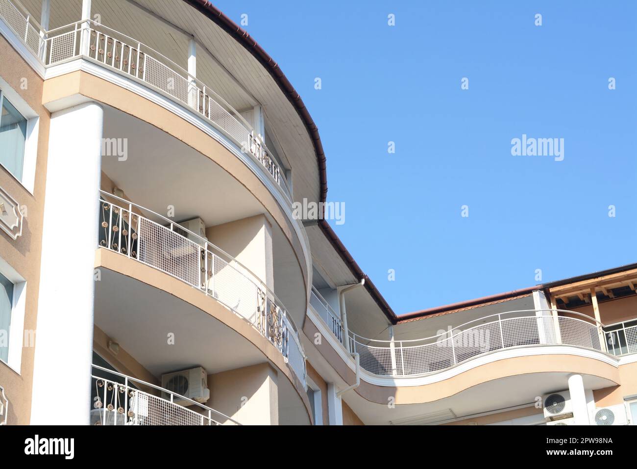 Exterior of beautiful residential building with balconies, low angle ...