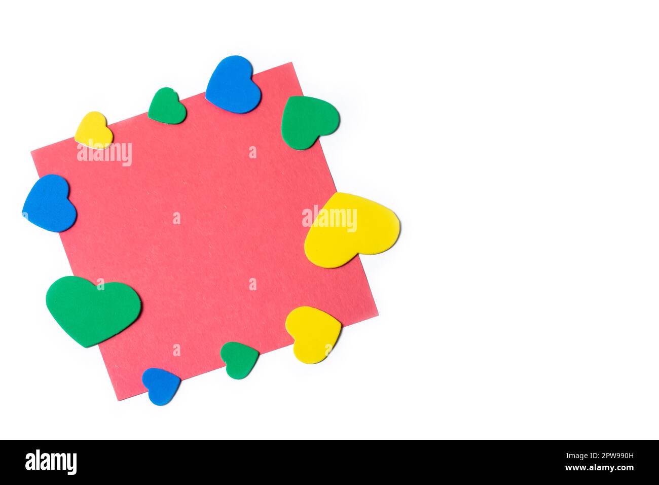 Blank paper note and multicolor hearts on white paper background ...