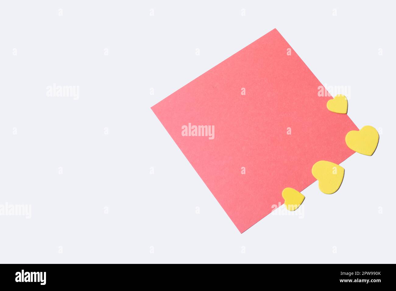 Blank paper note with small yellow hearts on white background. Love ...