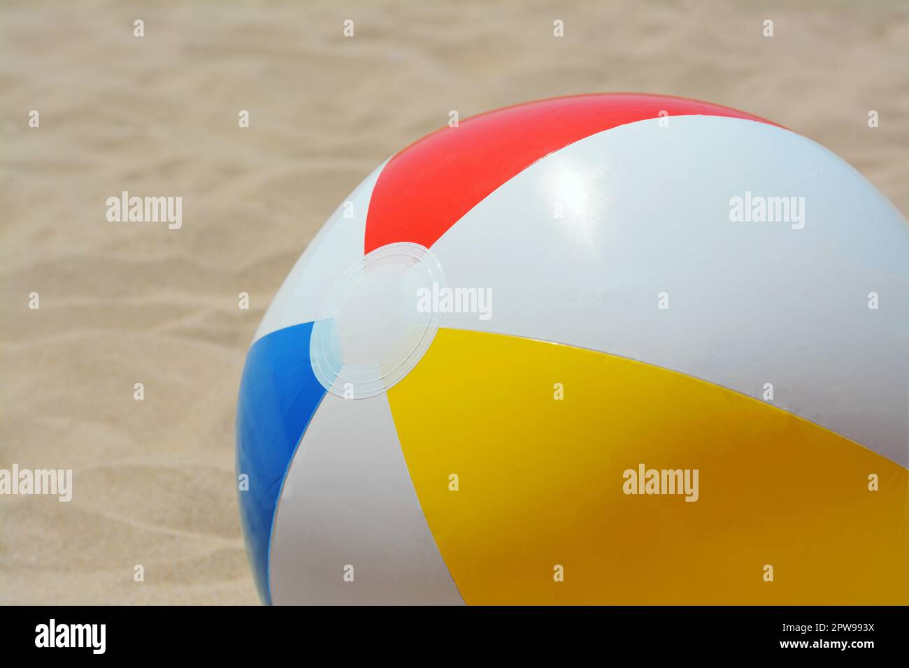 Beach ball on sand hi-res stock photography and images - Alamy