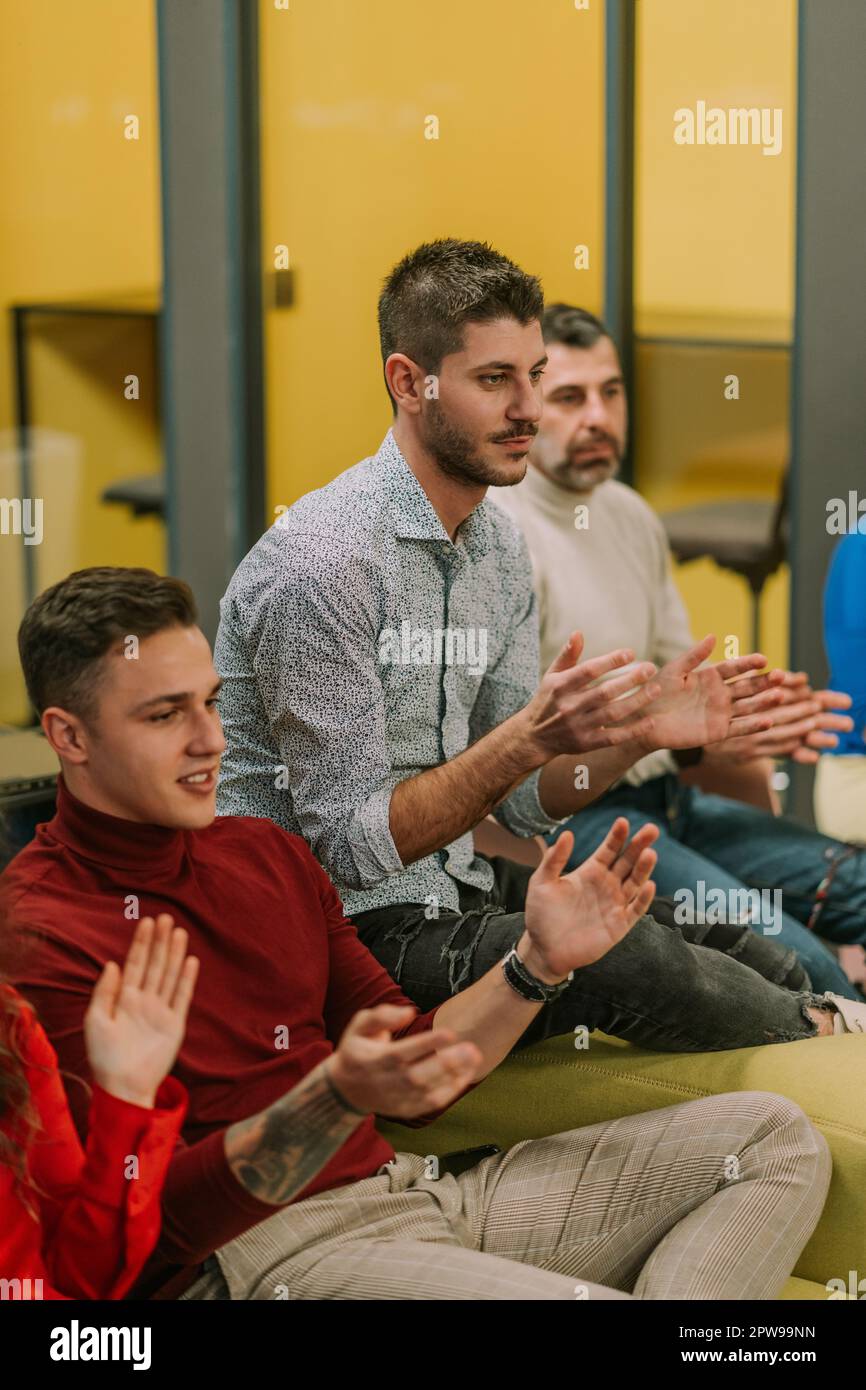 Good looking male people enjoying watching and listening to their ...