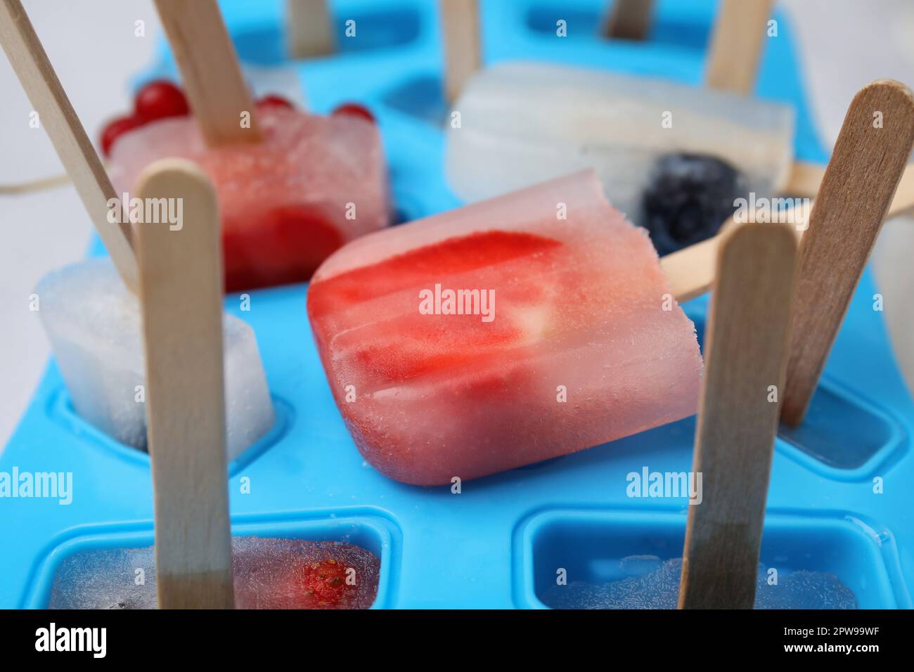 Mold with fruit and berry ice pops, closeup Stock Photo - Alamy