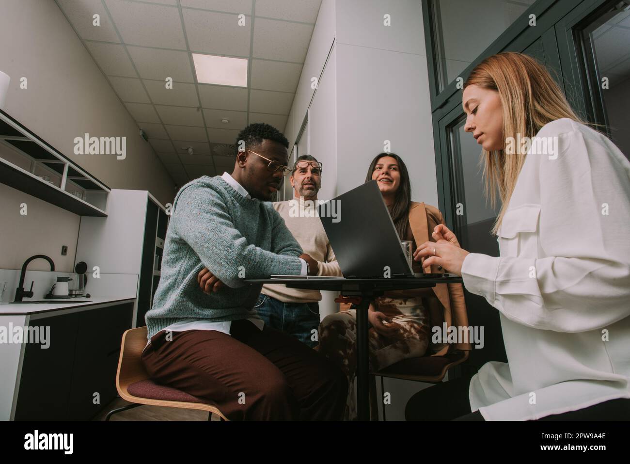 Different age of multiracial people working together at the office. Low ...
