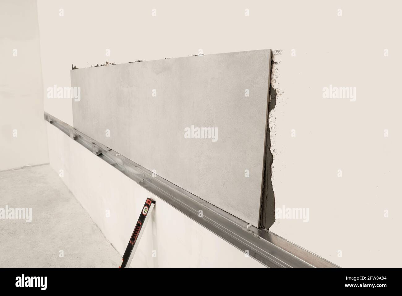 New wall tiles installed in room prepared for renovation Stock Photo ...