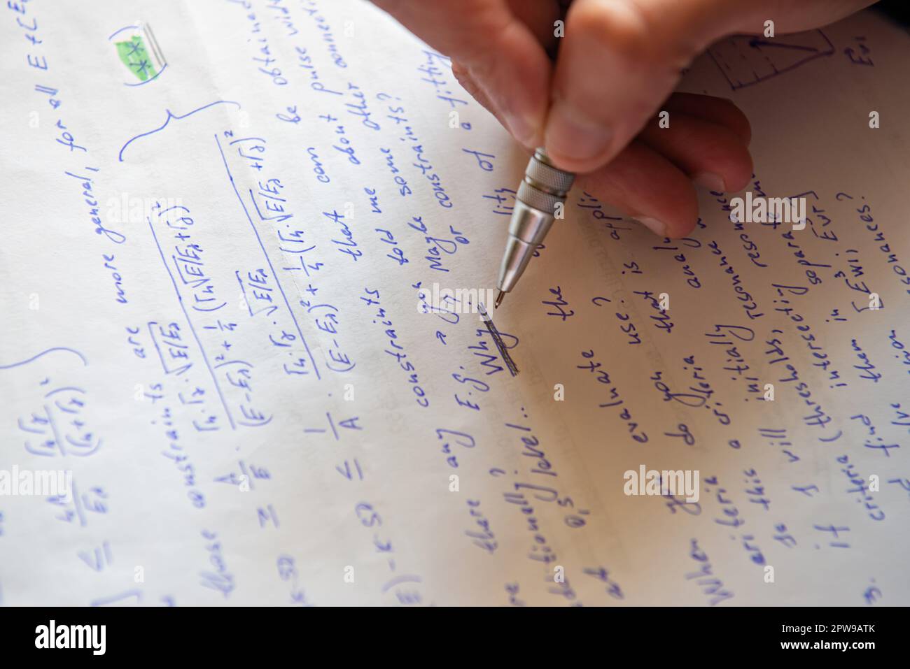 Student writing mathematical calculations on paper, closeup Stock Photo ...