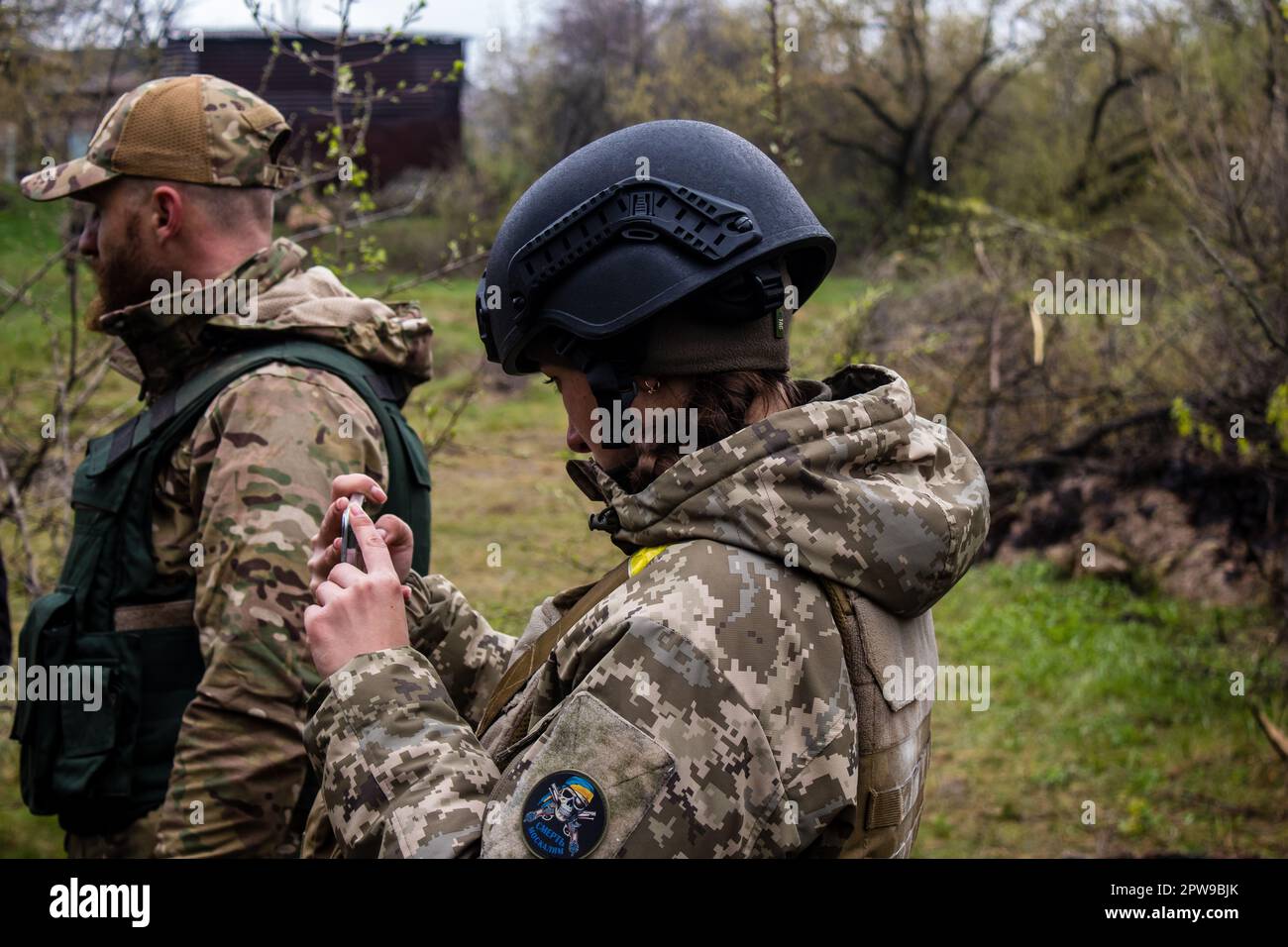 Ukrainian servicewoman work at the position of the artillery brigade at ...