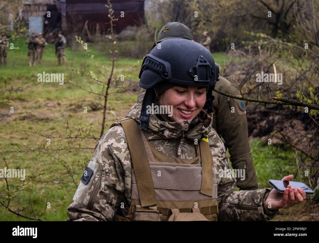 Ukrainian servicewoman work at the position of the artillery brigade at ...
