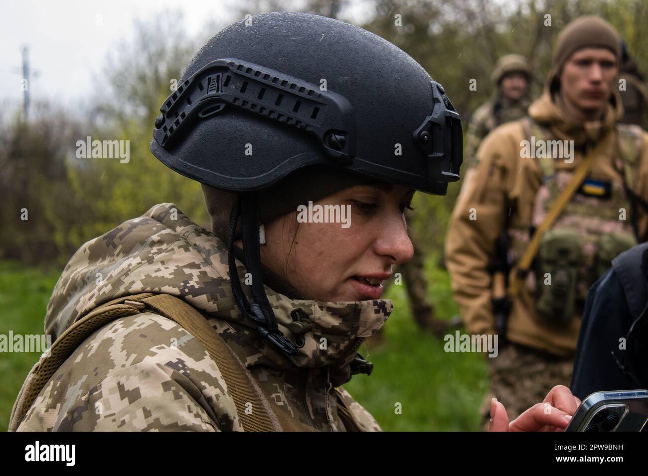 Ukrainian servicewoman work at the position of the artillery brigade at ...