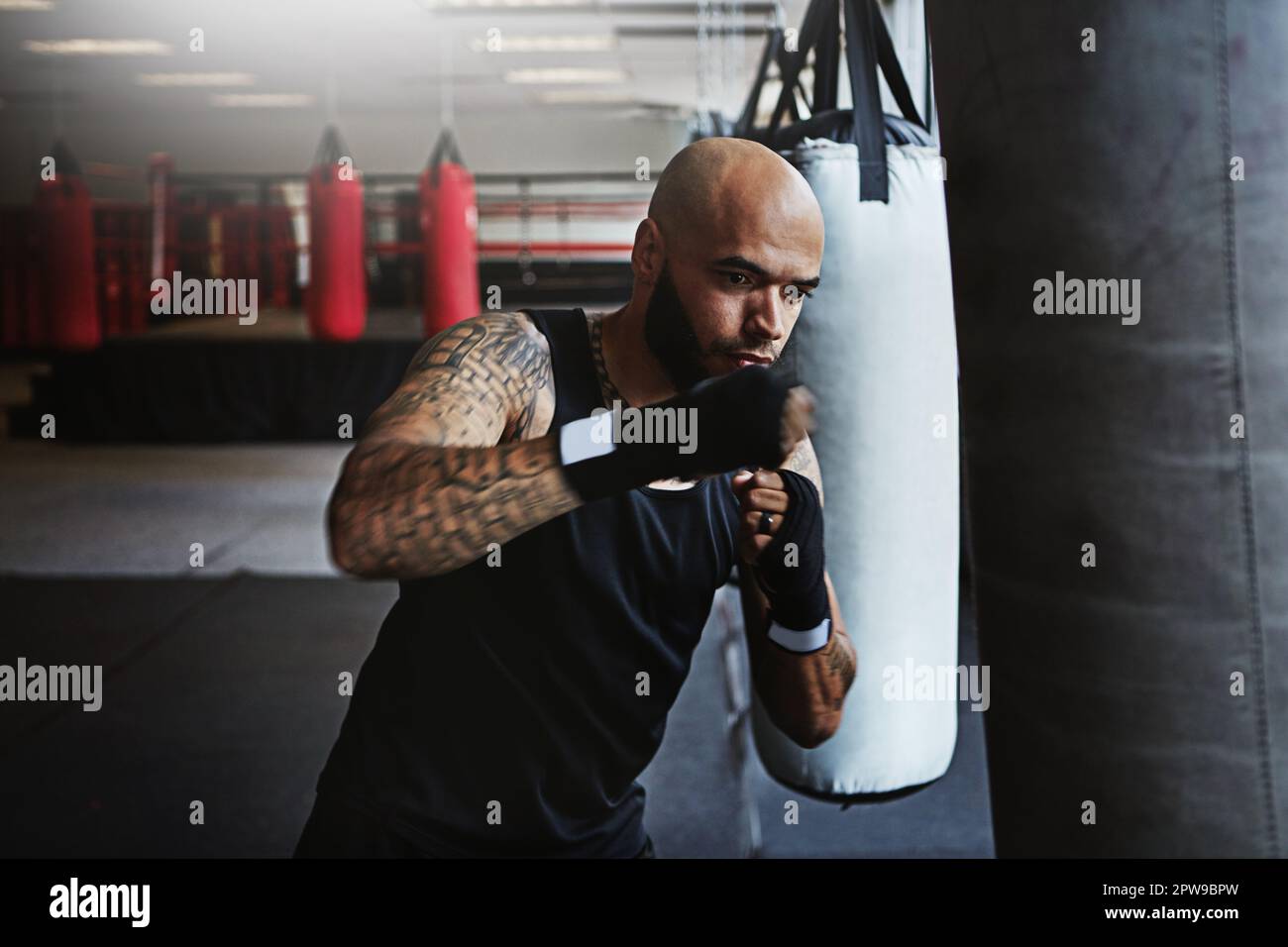 Even the greatest was once a beginner. a kick-boxer training in a gym ...