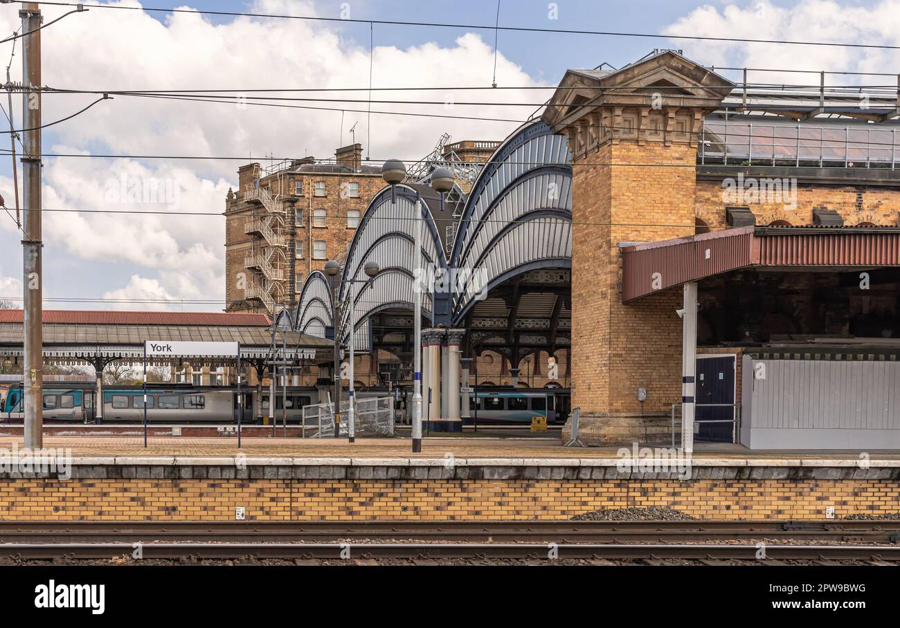 A historic 19th Century railway station with three iron and glass ...