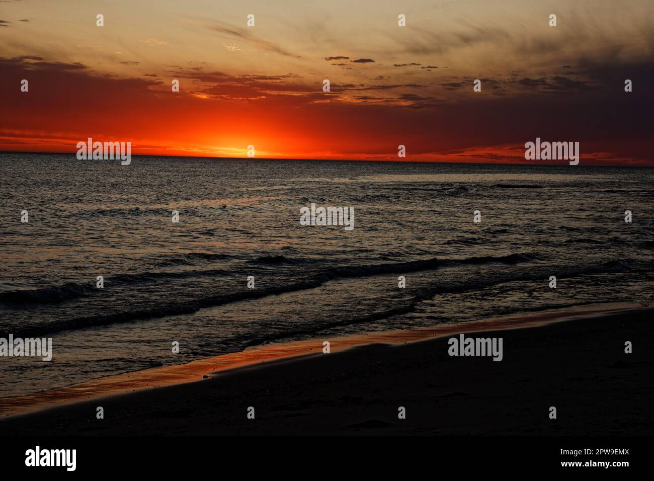 The setting sun in Bella Vista beach in Uruguay Stock Photo - Alamy