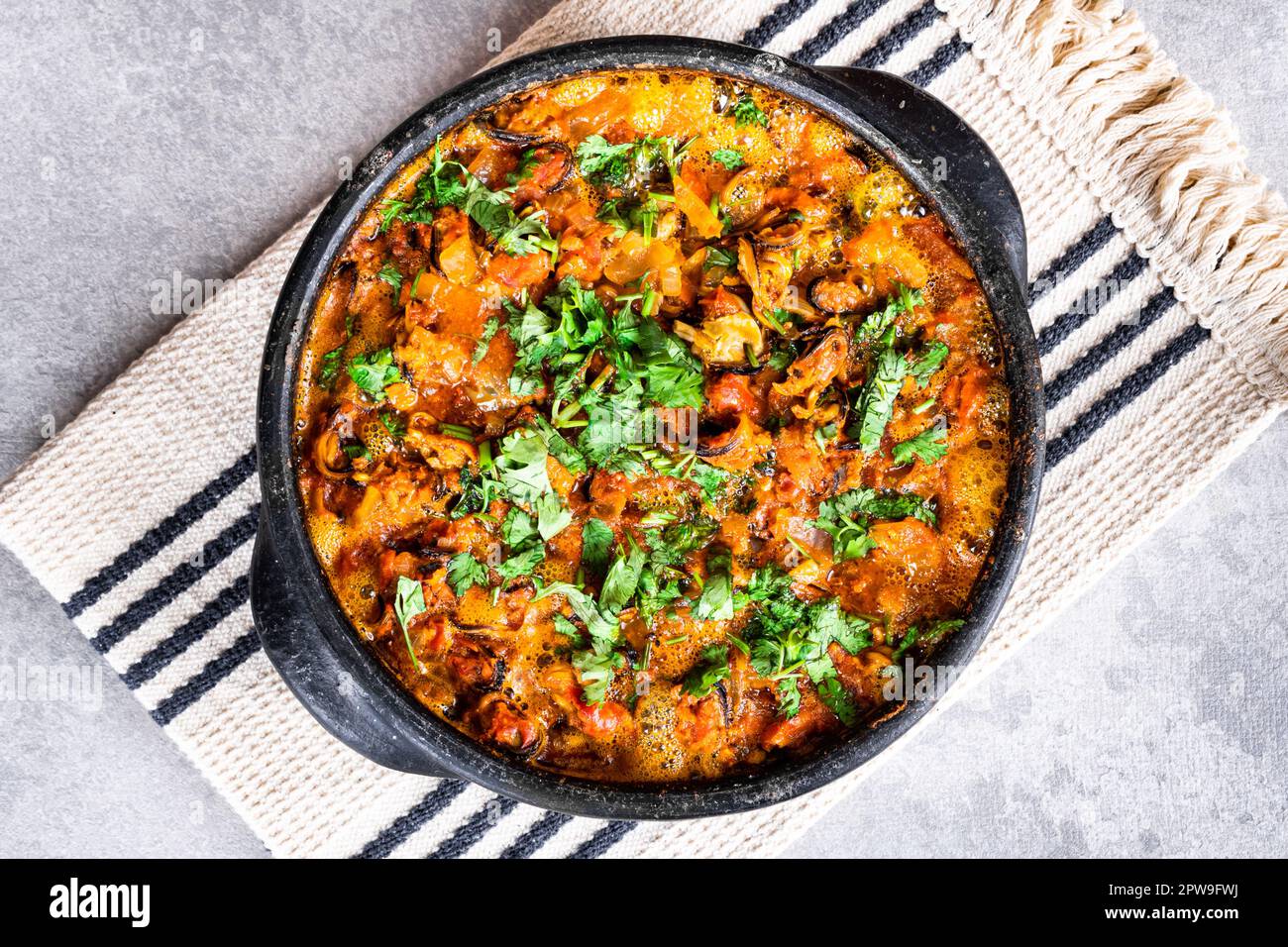 Charru Mussel, known in Brazil as a sururu moqueca, on white striped ...
