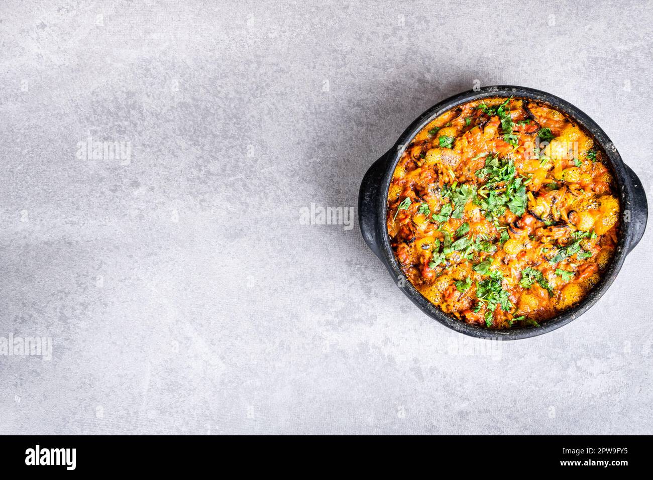Charru Mussel, known in Brazil as Sururu Moqueca, on white wooden table ...
